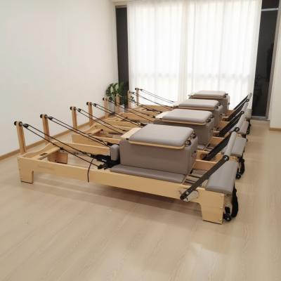 China Commercial Pilates Reformer High Quality Maple Wood Adjustable Bed Professional Fitness Equipment for Home/Studio Gym for sale