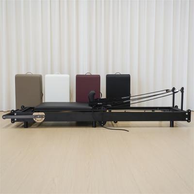China Luxury Portable Reformer Pilates Beds Foldable Gym Equipment Wooden Reformer Beige for sale