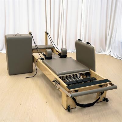 China Factory Direct Sale Portable Maple Wood Pilates Equipment and Training Accessories with Mat for Studio and Body Pilates Machine for sale