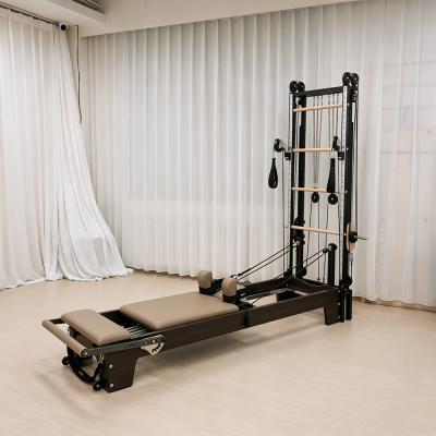 China Factory Wholesale Solid Wood Pilates Reformer With Spiral Half Trapeze Tower Custom Frame Surface Leather Color Logo Complete Standard Accessories for sale