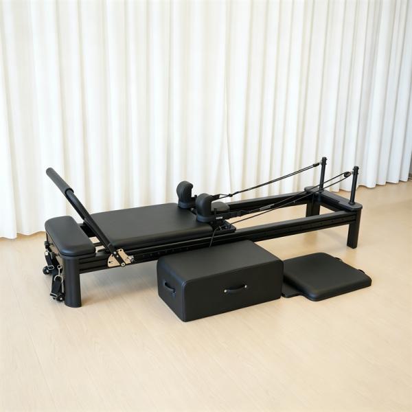 Quality OEM Black Aluminium Alloy Pilates Reformer Full Track Design With Auxiliary Cushion Accessories for sale