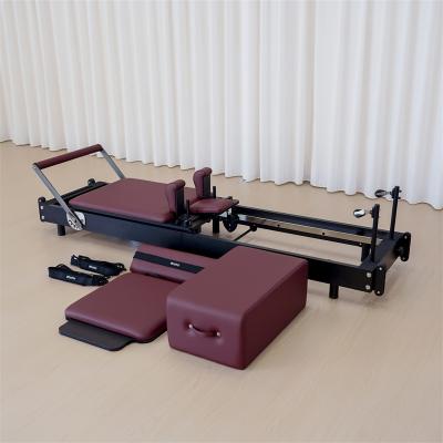 China Custom Foldable Wood Pilates Reformer Factory Supply Adjustable Pilates Bed With Complete Training Accessories for sale