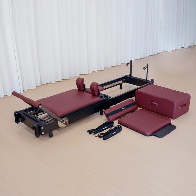 China Customized Foldable Maple Oak Wood Pilates Reformer Private Label Pilates Fitness Equipment For Distributors for sale