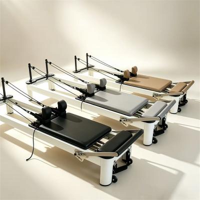 China Professional White Aluminum Pilates Reformer Smooth and Quiet Carriage Yoga Aluminum Reformer Pilates Premium for Sale for sale