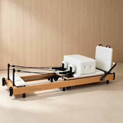 China Lightweight Foldable Wood Pilates Reformer Compact Storage Pilates Core Bed Commercial Use Fitness Workout Equipment for sale