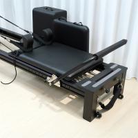 China User friendly Pilates Reformer machine featuring adjustable springs padded platform and sturdy frame for performance for sale