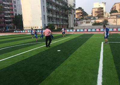 China Customized Yarn Shape Football Field Artificial Grass 9450 Stitches Density For University for sale