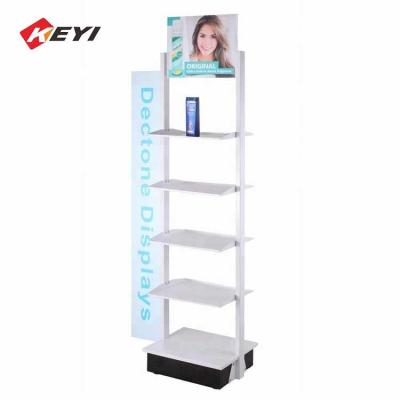 China Custom Retail Store Tiered Metal Shelf Shampoo Display Stand With Sign Holder Frame for sale