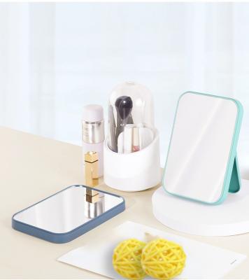 Cina Mini cerchio donna pelle specchio cosmetico logo personalizzato e il design per appesa a parete in vendita