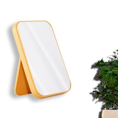 Cina Mini cerchio donna pelle specchio cosmetico logo personalizzato e il design per appesa a parete in vendita