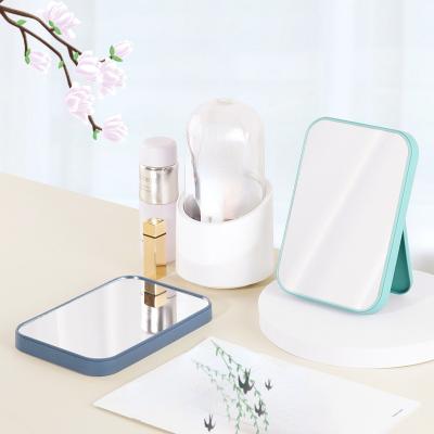 Cina Mini cerchio donna pelle specchio cosmetico logo personalizzato e il design per appesa a parete in vendita
