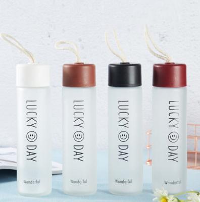 China Custom Logo Portable Water Bottles Colored Frosted Spray Glass Water Bottle With Bamboo Lid for sale