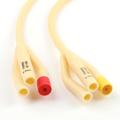 China medical antimicrobial coated latex 3 way silicone urethral disposable nelaton foley catheter for sale