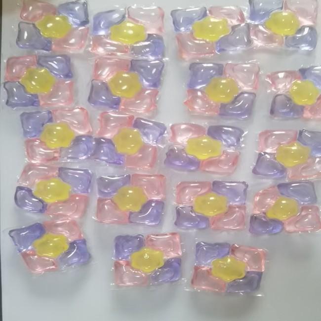 Yellow Purple Pink 5-in-1 laundry detergent pods in plastic bottle packaging