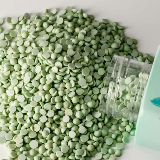 Laundry booster beads product display showing colorful beads