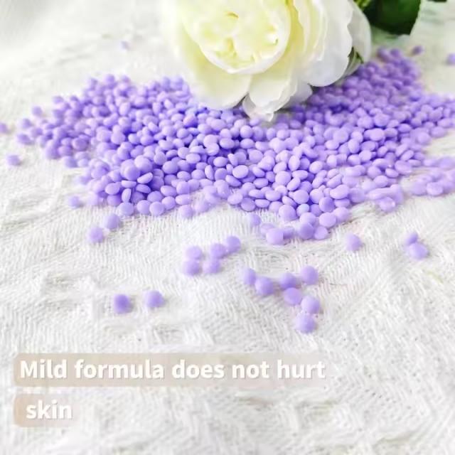Laundry scent booster beads being poured into hand