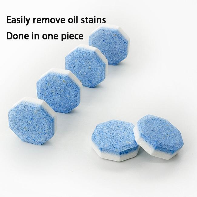 Dishwasher tablets in use with clean dishes