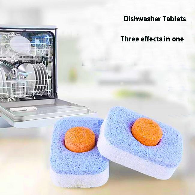Dishwasher tablets in use with sparkling clean dishes