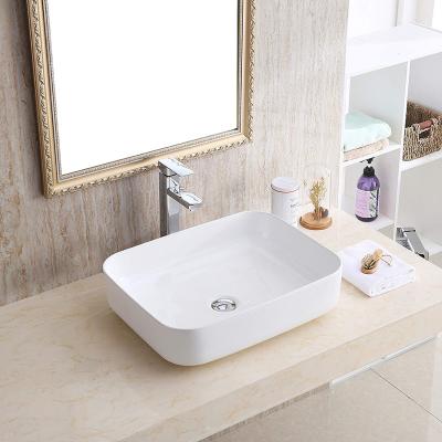 China Modern Bathroom Rectangular Above Counter White Ceramic Vessel Vanity Sink for sale