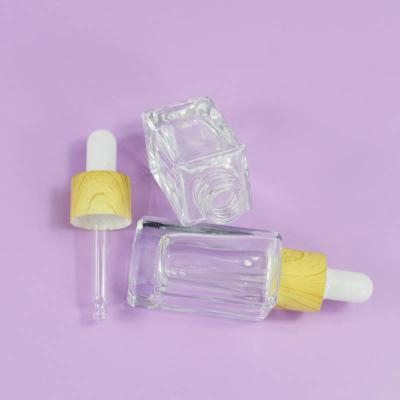 Cina Stampa serigrafica 10ml 15ml Imballaggio in vetro Bottiglia a forma quadrata per olio essenziale per capelli in vendita