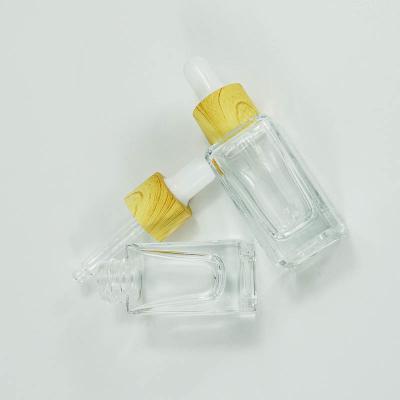 Cina Stampa serigrafica 10ml 15ml Imballaggio in vetro Bottiglia a forma quadrata per olio essenziale per capelli in vendita