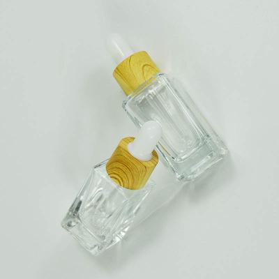 Cina Stampa serigrafica 10ml 15ml Imballaggio in vetro Bottiglia a forma quadrata per olio essenziale per capelli in vendita