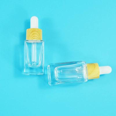 Cina Stampa serigrafica 10ml 15ml Imballaggio in vetro Bottiglia a forma quadrata per olio essenziale per capelli in vendita
