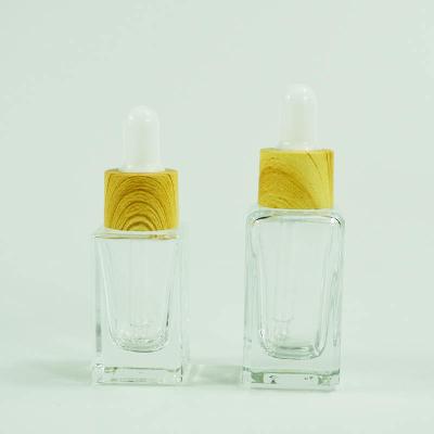Cina Stampa serigrafica 10ml 15ml Imballaggio in vetro Bottiglia a forma quadrata per olio essenziale per capelli in vendita