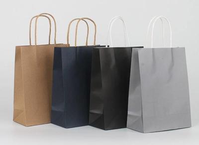 Cina Logo Paper Kraft Shopping Bag su ordinazione che imprime con la maniglia in vendita