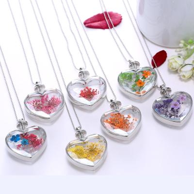 China Beautiful silver/gold plated crystal pendant with dry flower inside necklace for sale