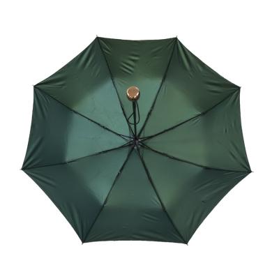 China 8 Ribs Manual 3 Folding Umbrella With Wooden Handle for sale