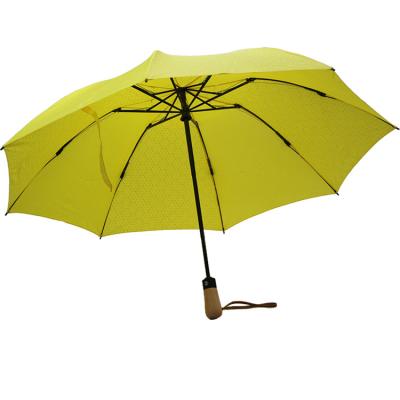 China Metal Ribs Three Folding Umbrella Yellow Color Waterproof for sale