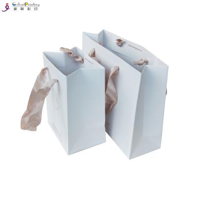 Cina Laminazione di carta lucida stampata abitudine biodegradabile dei sacchetti della spesa della maniglia del nastro in vendita