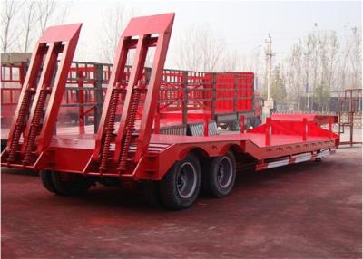 China Tri - axle low flatbed truck Semi - trailer for construction machinery transport for sale