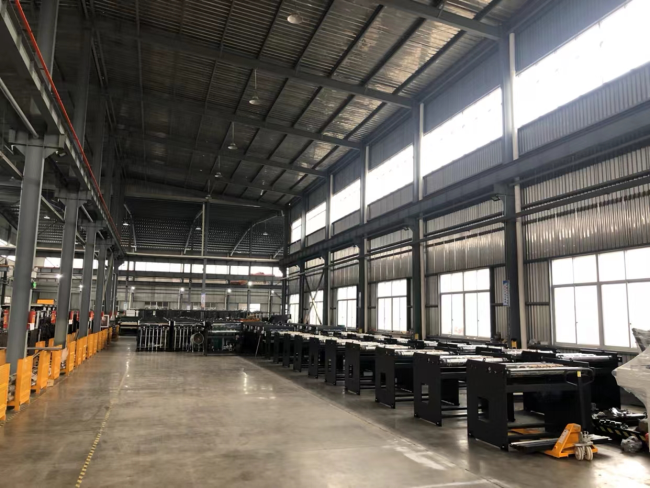 Workshop with film lamination machine installation