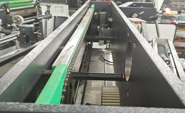 Detailed view of film lamination machine components