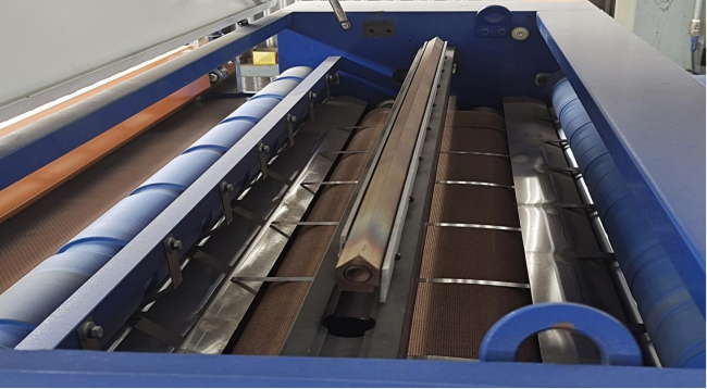 Detailed view of high speed film lamination machine components