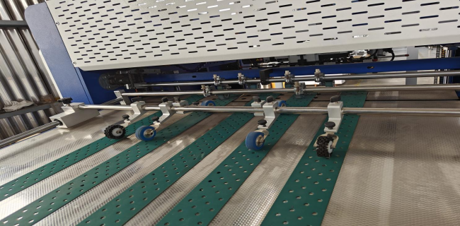 Detailed view of film lamination machine components