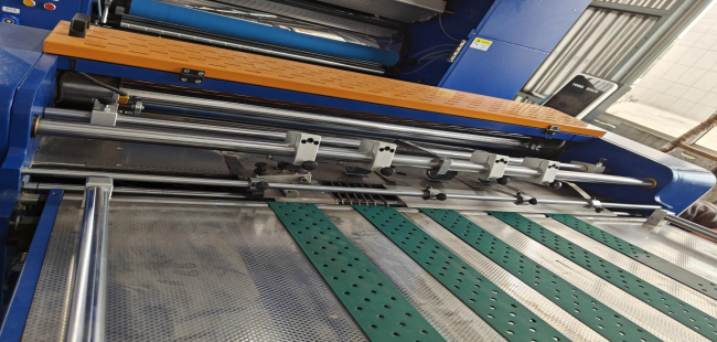 Close-up of film lamination machine operation