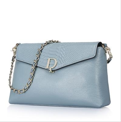 China Genuine leather handbags cowhide serpentine shoulder bag with D-lock for sale