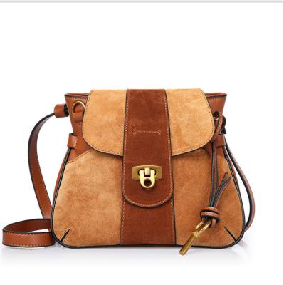 China Nubuck Leather Bags Saddle Bag with Lock Closure Patchwork Shoulder bag for sale