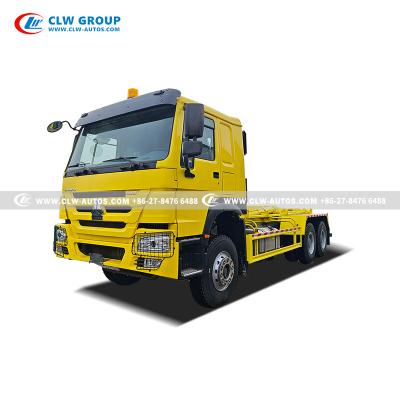 China HOWO Heavy-Duty Hook Lift Garbage Truck with Powerful Hydraulic System, Sturdy Build, and Smart Safety Features for sale