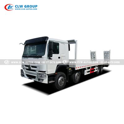 China Sinotruk HOWO 8x4 400HP Flatbed Truck with 9m Manganese Steel Deck and Hydraulic Ramp for Heavy Machinery Transport for sale