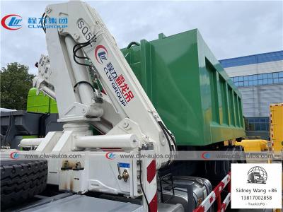 China SINOTRUK HOWO 8x4 LHD Hydraulic Hooklift Garbage Truck With Folded Arm Crane for sale