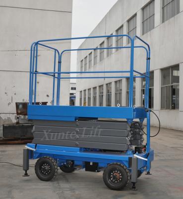 China 500Kg Loading Capacity Hydraulic Mobile Scissor Lift with 6 Meters Platform Height for sale