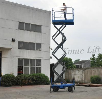 China Hydraulic Mobile Scissor Lift 6 Meters Platform Height 1 Ton Loading Capacity For Exhibition Hall for sale