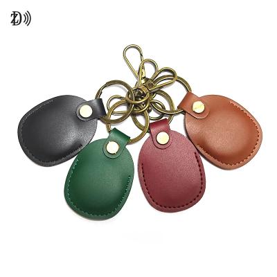 China Upscale Keyfob Embossed Customized Keychain Durable Waterproof 13.56MHz NFC Key Tag Leather Keyfob Wearable NFC RFID Keyfob for sale