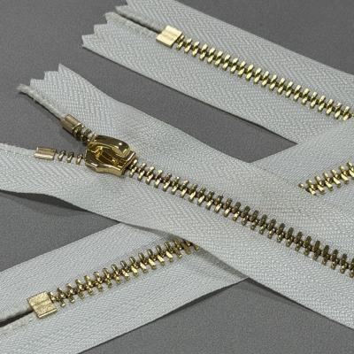 China Unique Tooth Profile #5 Y Shape Metal Zipper Deep Bite Shiny Gold for sale