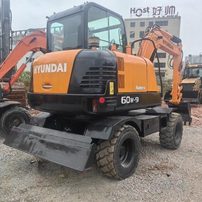 China Used Hyundai 60W-9 Wheel Excavator 5.5Ton Yanmar Engine Mobile Digger for Road Repair Municipal Pipeline Construction for sale