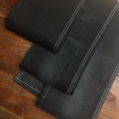 中国 Tencleの綿の物質的なデニムの生地のジーンズの黒い色9oz 販売のため